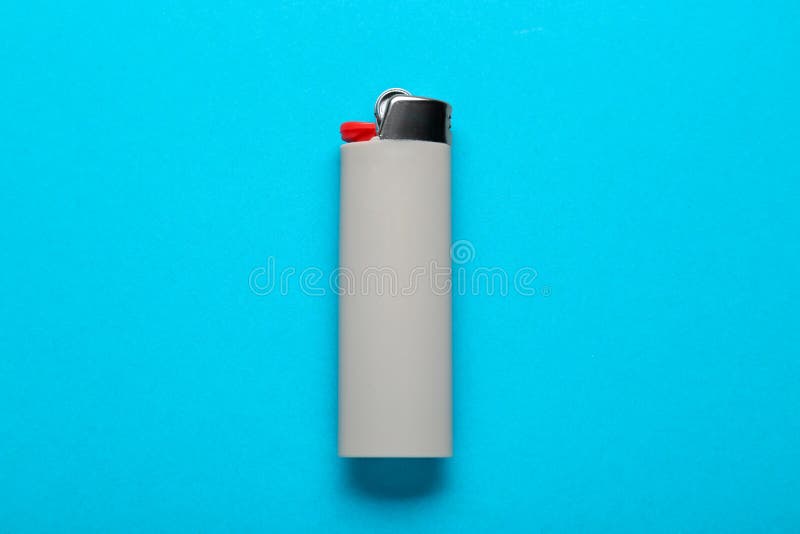 Gray Plastic Cigarette Lighter on Light Blue Background, Top View Stock ...