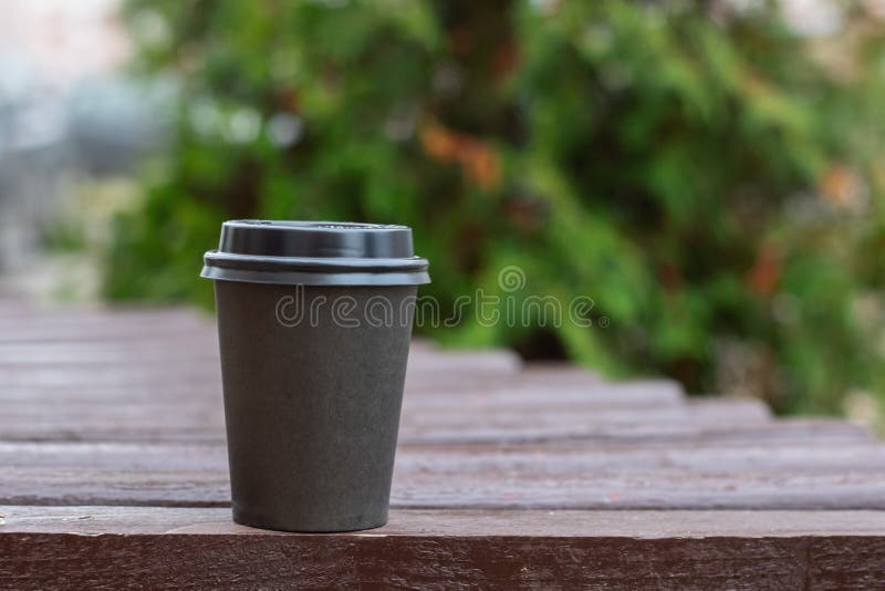 Gray Plastic Cup with Coffee on the Background of Branches Stock Image ...