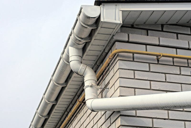 Gray Plastic Gutter Pipe on White Brick Wall Stock Image - Image of ...