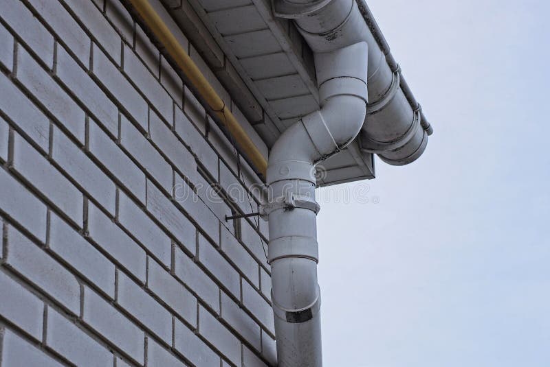 Gray Plastic Gutter Pipe on White Brick Wall Stock Photo - Image of ...