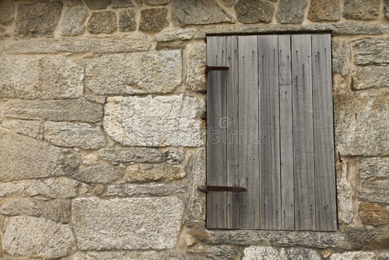 Gray Rectangular Wooden Window in a Wall of Large Granite Stones Stock ...