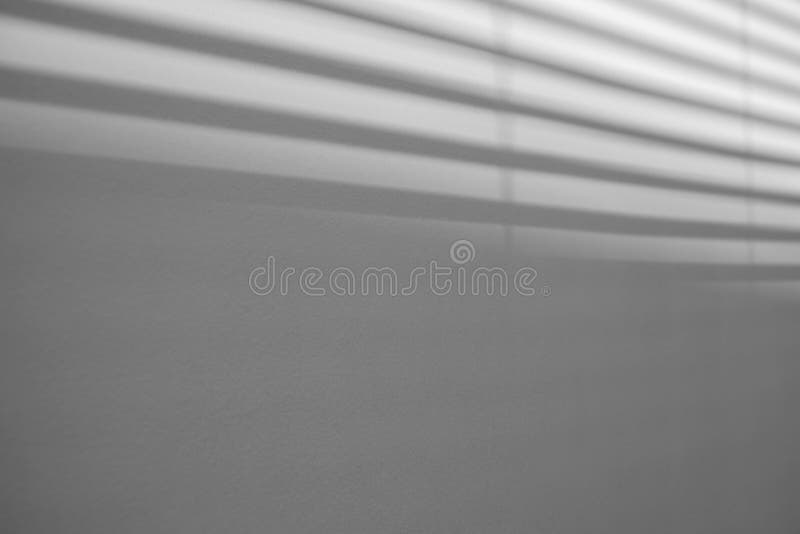 Gray Shadow of Blinds Windows Overlay on the White Wall Background ...