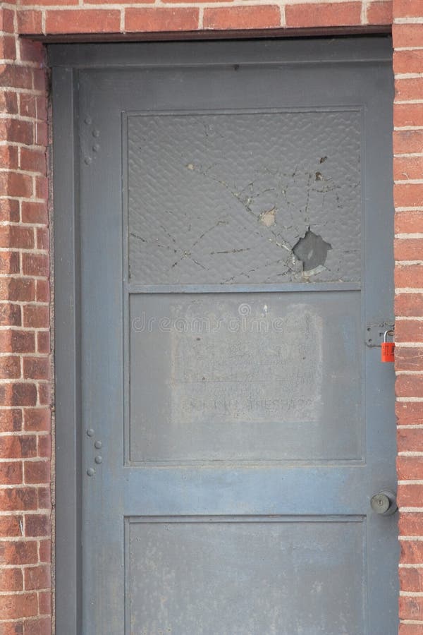 Gray Shattered Door with Red Padlock Stock Photo - Image of shattered ...
