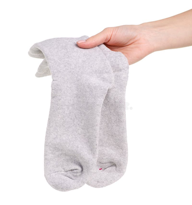 Gray socks in hand stock photo. Image of cute, green - 129509380