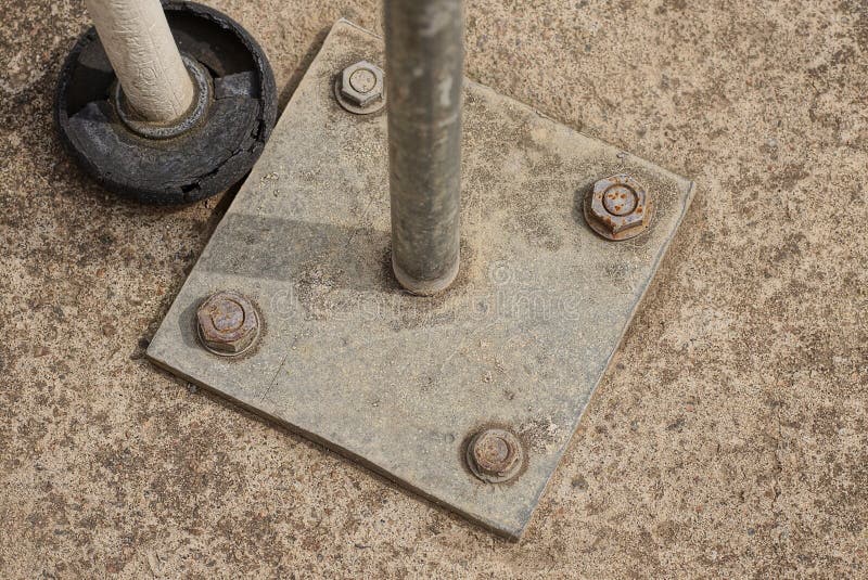Gray Square Iron Plate with Pipe Bolted into Concrete Floor Stock Image ...