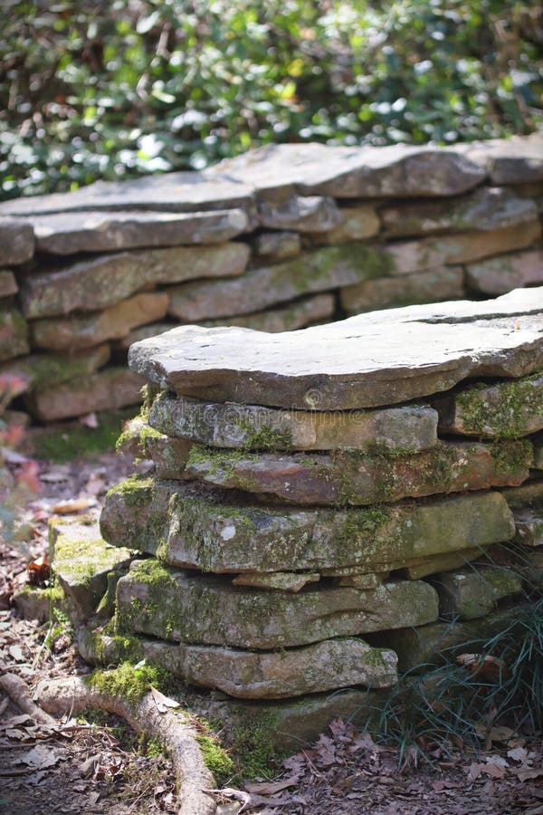 Stacked Gray Stone Benches with Green in Background Stock Image - Image ...