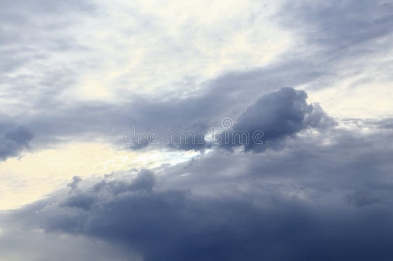 Gray Storm Clouds Float Across a Bright Sky, Marking the Start of a ...
