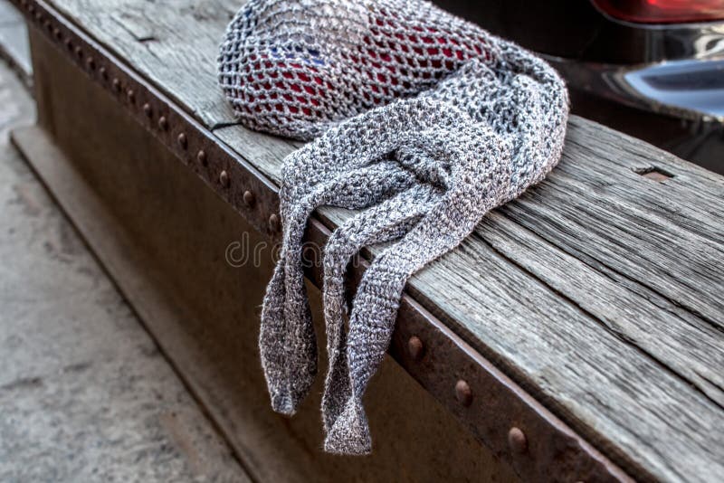 Gray String Bag with Red Knitting Clews on Old Wood Texture Background ...