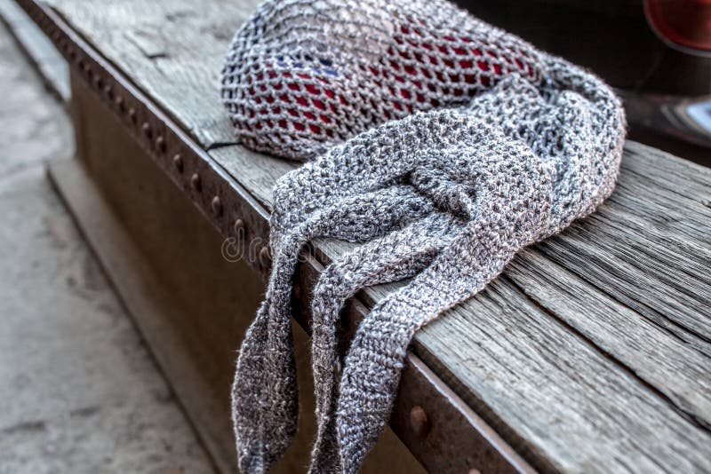 Gray String Bag with Red Knitting Yarn on Old Wood Texture Stock Photo ...