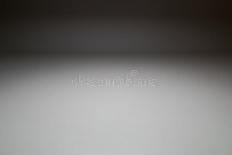 Gray Studio Background with Lighted Floor and Dark Wall Stock Photo ...