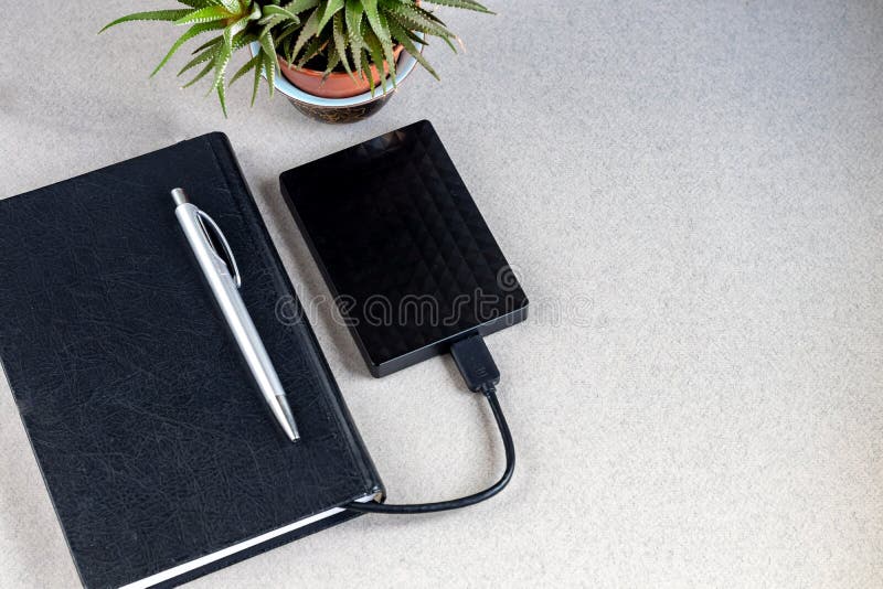A Gray Surface with the Necessary Items on it. Diary with Pen, Samsung ...