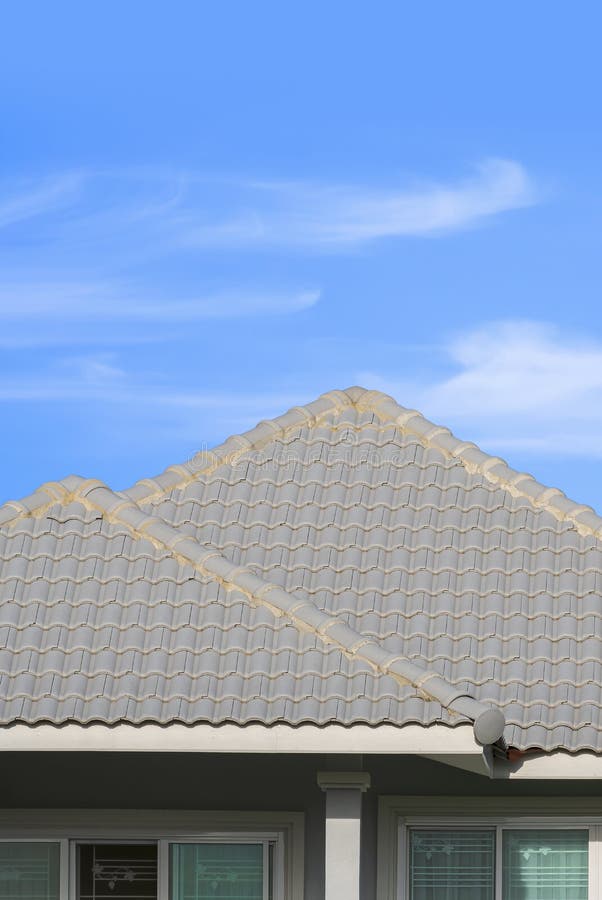 Gray Tile Roof of Modern House Against Cloud on Blue Sky Background in ...