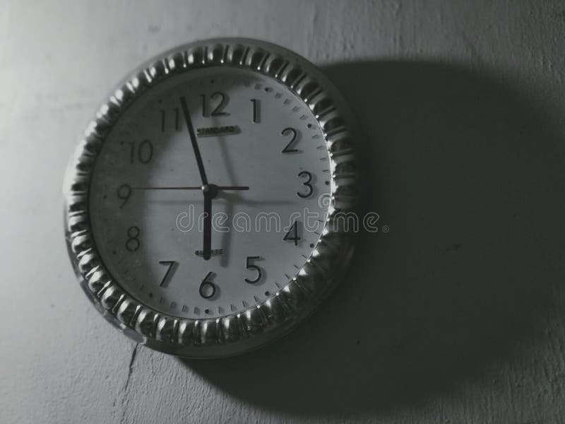 Gray wall clock shadow editorial photography. Image of gray - 210554872