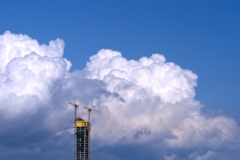 Clouds in the Sky and Building with Tower Cranes Stock Image - Image of ...
