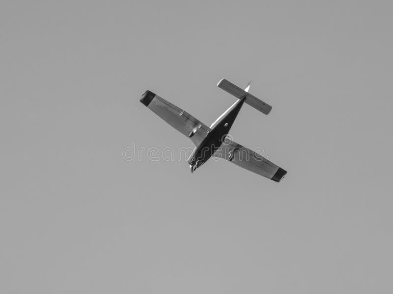 Single-engine Plane Flying in Gray Sky Stock Image - Image of plane ...