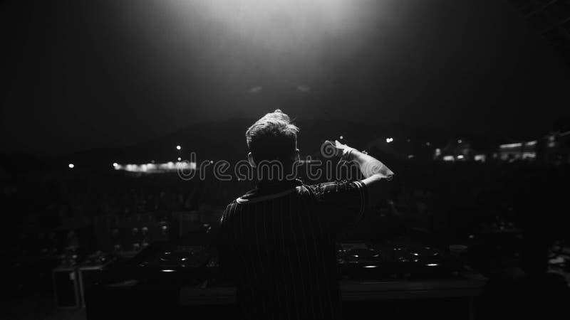 Grayscale Back View of a Male DJ on a Stage Stock Image - Image of ...