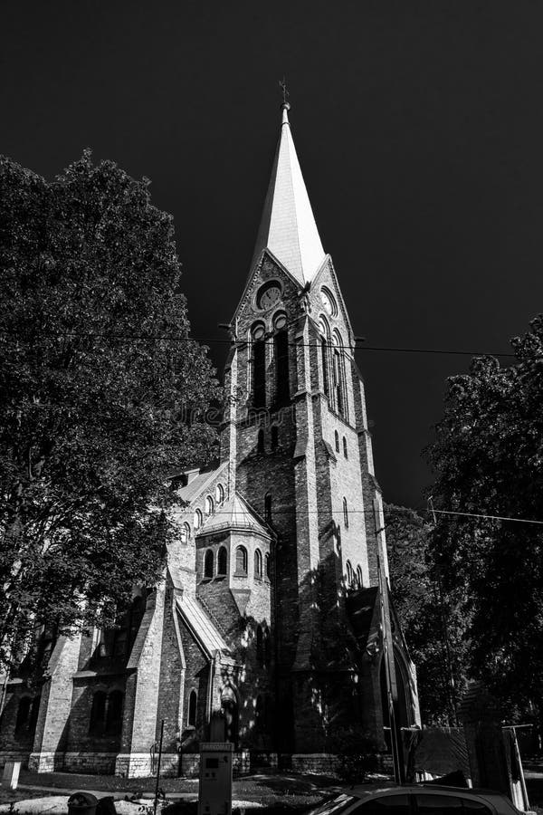 Grayscale of a Beautiful High Church Surrounded by Trees at Night Stock ...