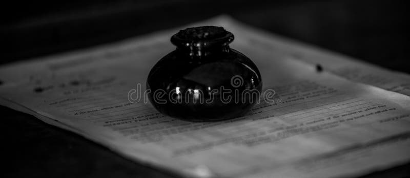 Grayscale Closeup Shot of an Antique Ink Jar on a Newspaper Stock Image ...