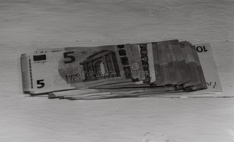 Grayscale Closeup Shot of a Small Stack of Euro Banknotes on a Table ...