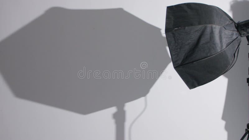 Grayscale Footage of Shadow of a Man Setting Up His Camera Lights ...