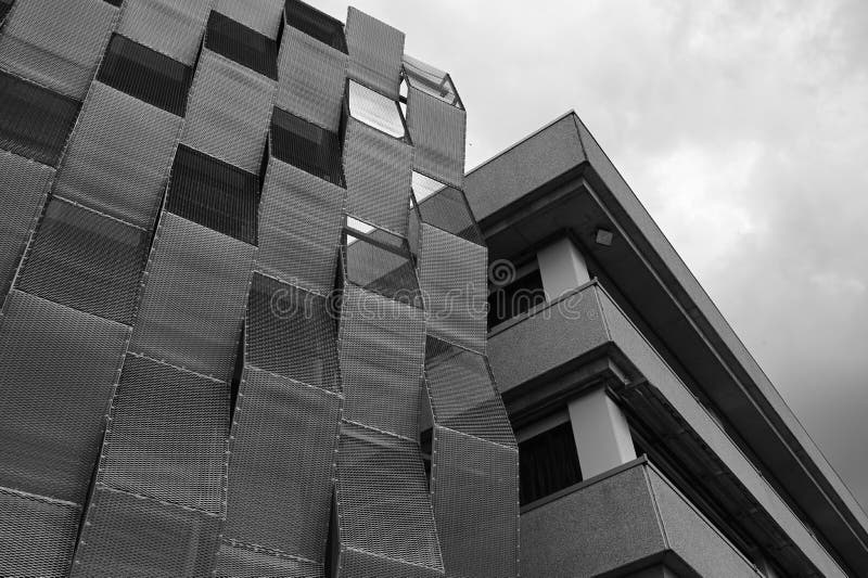 Grayscale of a High Rise Modern Building Exterior Stock Photo - Image ...