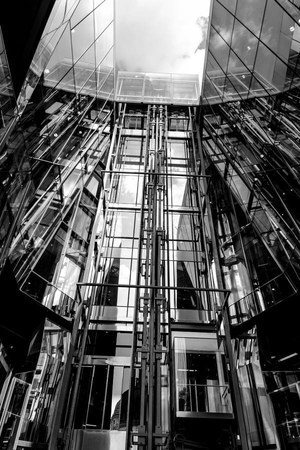 Grayscale Low Angle View of Glass Elevators Stock Image - Image of ...