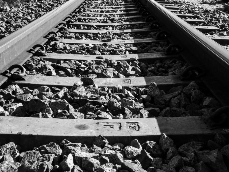 Grayscale of Old Railroad Tracks Covered with Pebbles Stock Photo ...