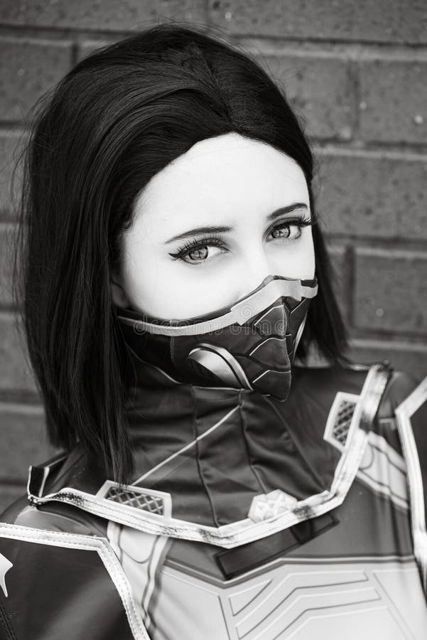 Grayscale Photo of a Cosplayer in Front of a Brick Wall Stock Photo ...