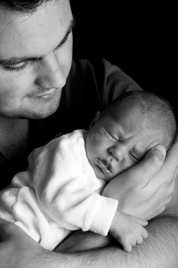 Grayscale Photo Of Man Holding Baby Picture. Image: 82962336