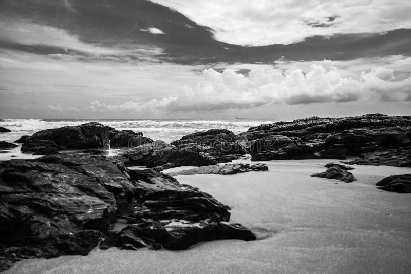 Grayscale Photography of Rocks on Seashore during Daytime Stock Photo ...