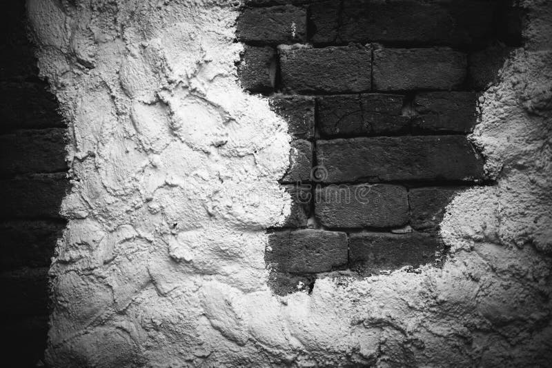 Grayscale Shot of a Brick Wall Framed with Rough Concrete Finishing ...