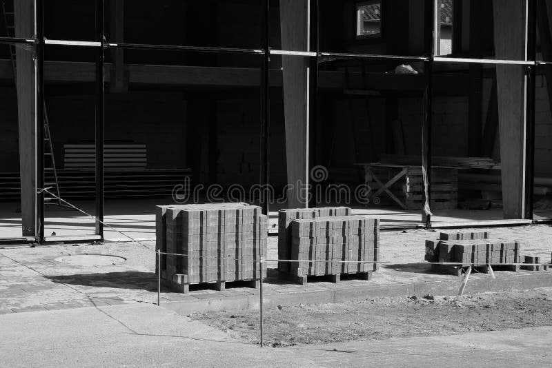 Grayscale Shot of Bricks in Front of a Building Being Build Stock Image ...
