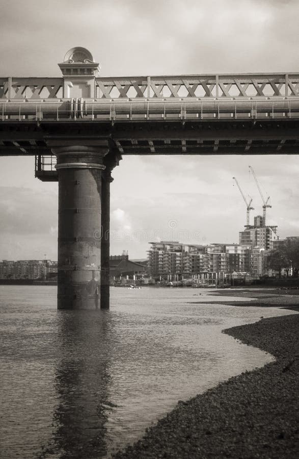 Grayscale Shot of a Bridge Over a Low Tide River Stock Image - Image of ...
