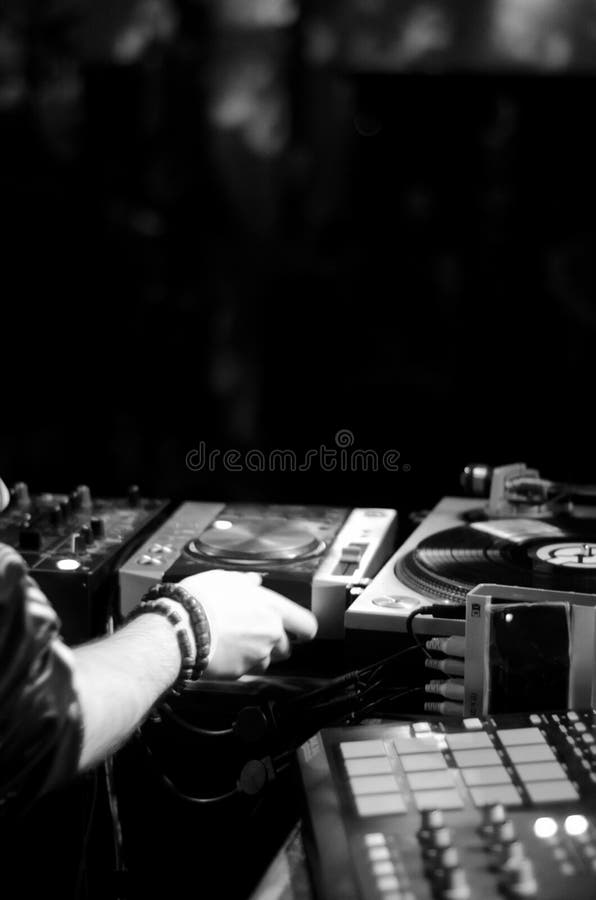Grayscale Shot of a Disc Jockey Working on Turntables Stock Photo ...