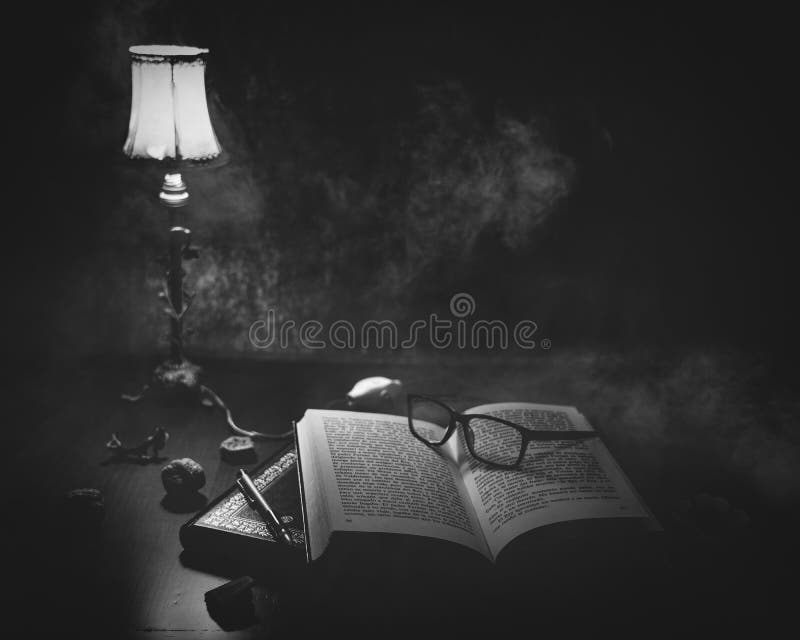 Grayscale Shot of Glasses on an Open Book with a Lamp and Smoke Stock ...