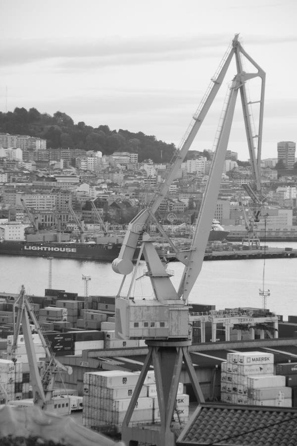 Grayscale Shot of a Loading and Unloading Crane for Cargo Containers on ...