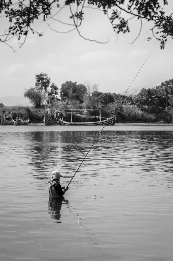 Grayscale Shot of a Man Fishing in the Lake Stock Photo - Image of bali ...