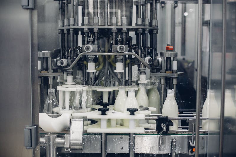Grayscale Shot of a Milk Bottling Machine in a Factory Stock Image ...
