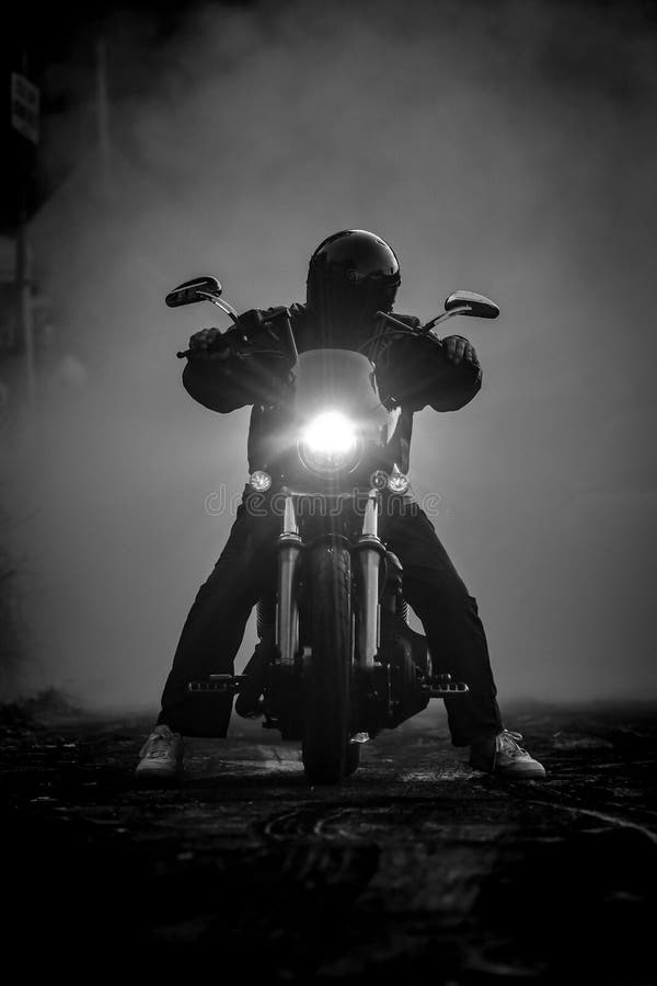 Grayscale Shot of Motorcycle Rider Facing the Camera with the Light on ...