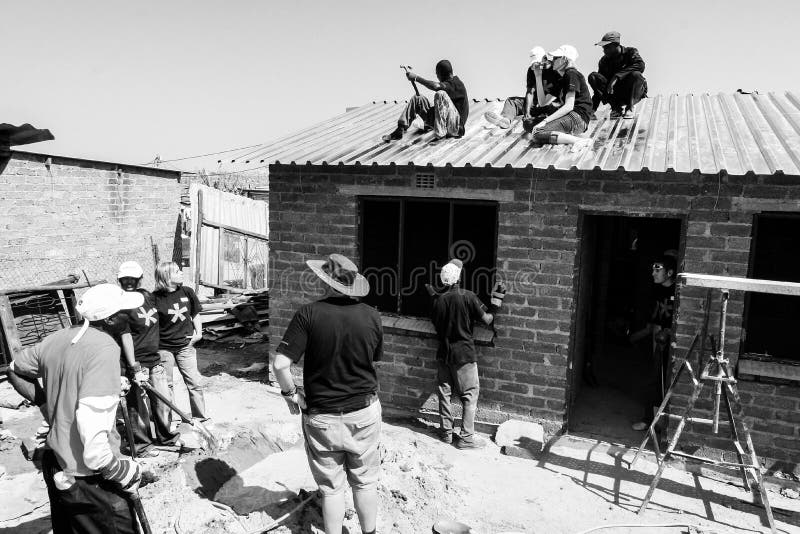 Grayscale Shot of People Building a Low Cost House in Soweto Editorial ...