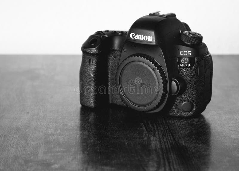 Grayscale Shot of a Professional Canon DSLR Camera on the Table ...