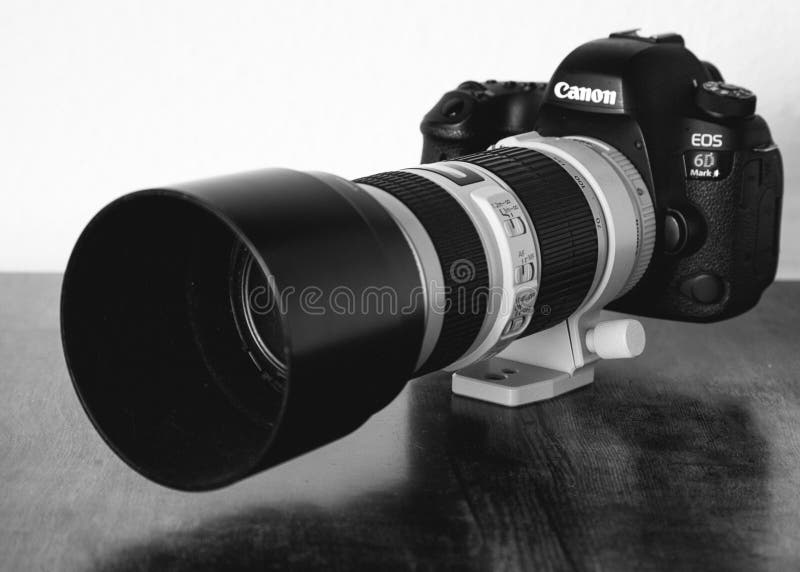 Grayscale Shot of a Professional DSLR Camera on the Table Editorial ...