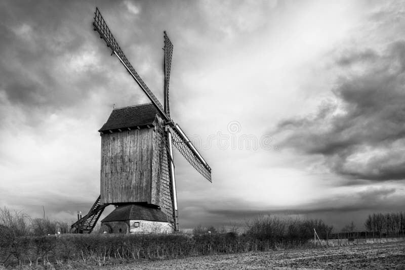 Grayscale of an Old Windmill Under a Cloudy Sky at Daylight Stock Image ...