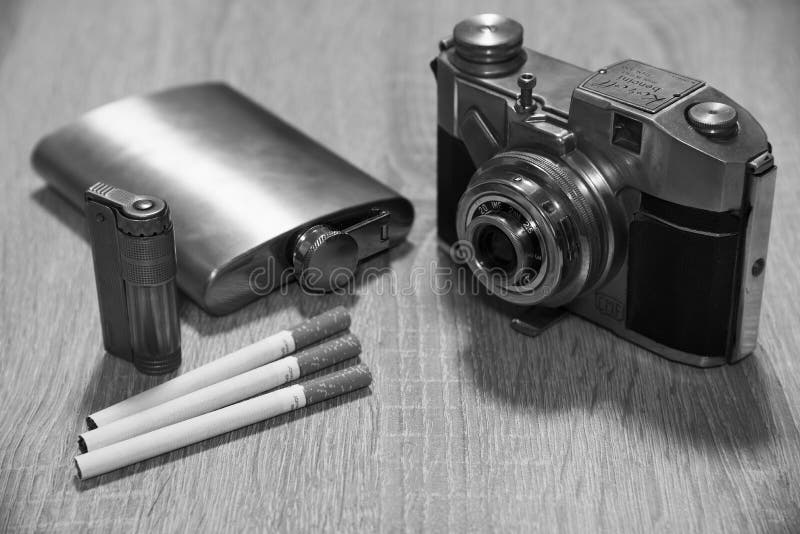 Grayscale Shot of Three Cigarettes, Lighter, Vintage Camera and Apv Mod ...
