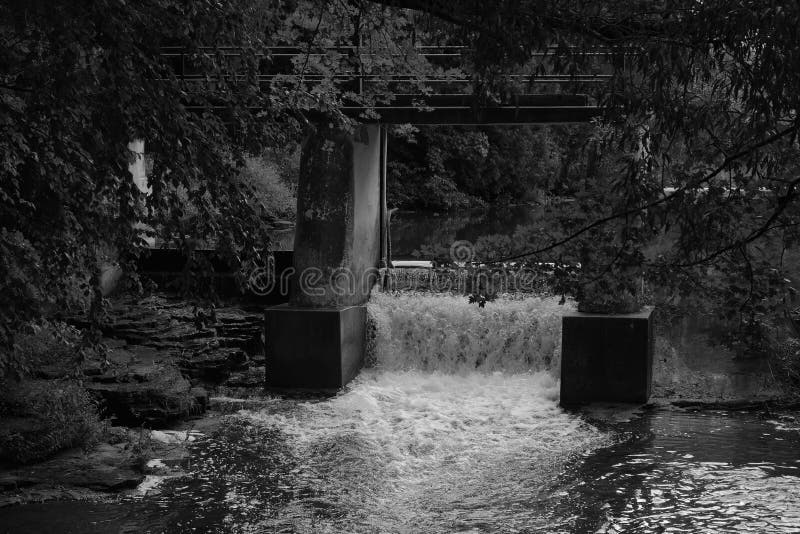 Grayscale Shot of Water Flowing Over a Dam Stock Image - Image of ...