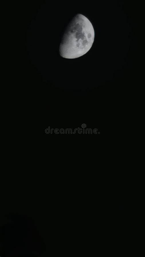 Grayscale Vertical Shot of Moon in a Dark Night Sky Stock Image - Image ...