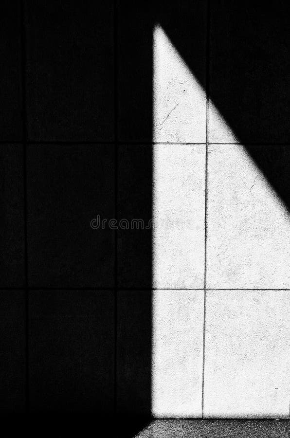 Grayscale Vertical Shot of Shadow and Sunlight on the Wall Stock Image ...