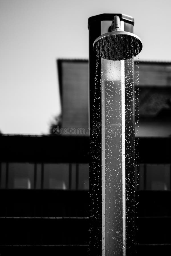 Grayscale Vertical Shot of Water Droplets Falling from a Shower Stock ...