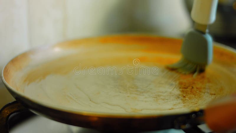 Grease the pan with oil stock video. Video of chips - 248904581