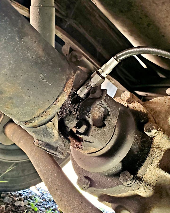Greasing the drive shaft stock photo. Image of equipment - 365547884